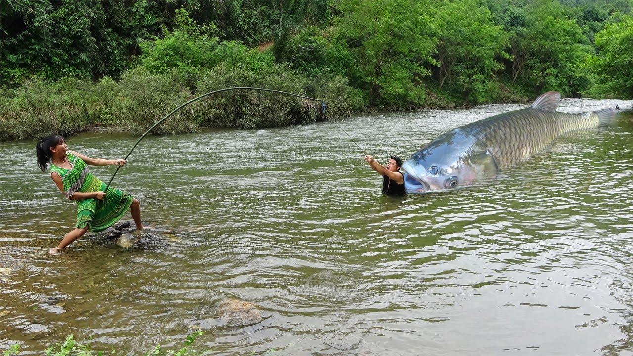 Survival skills: Primitive fishing catch big fish at river - Cooking ...