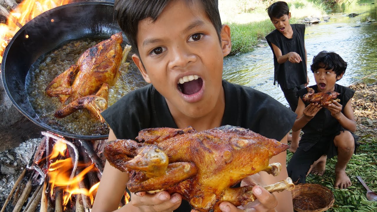 Survival Skills - Primitive cooking chicken in forest and eating ...